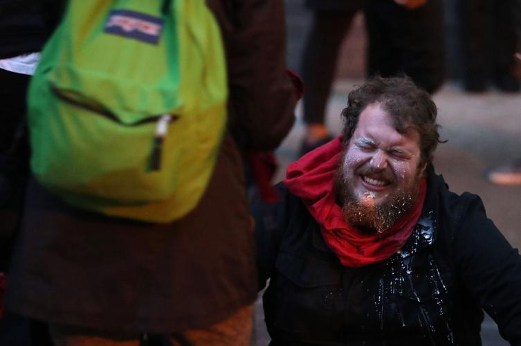 Twelve arrested, two police officers injured following protests at Munk ...