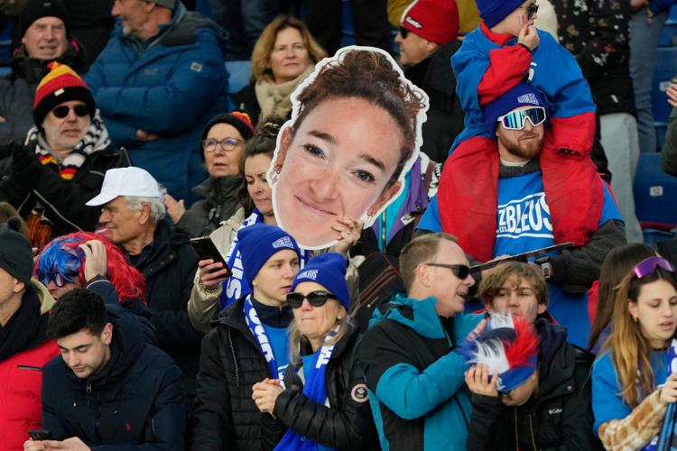 Fans from around the world fuel the Olympic spirit, in photos