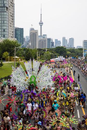 Caribbean Carnival parade dancers, mas bands deliver sizzle