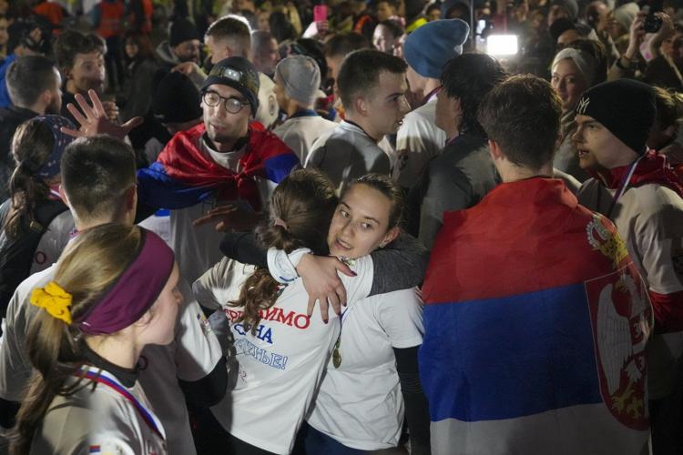 Serbia's protesting students and supporters of the president hold ...