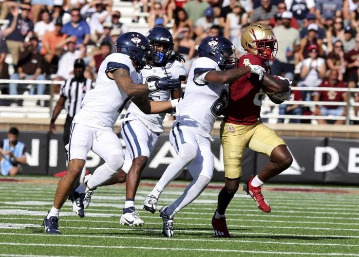 Kye Robichaux runs for 2 TDs; BC outlasts UConn 21-14 for 4th straight win