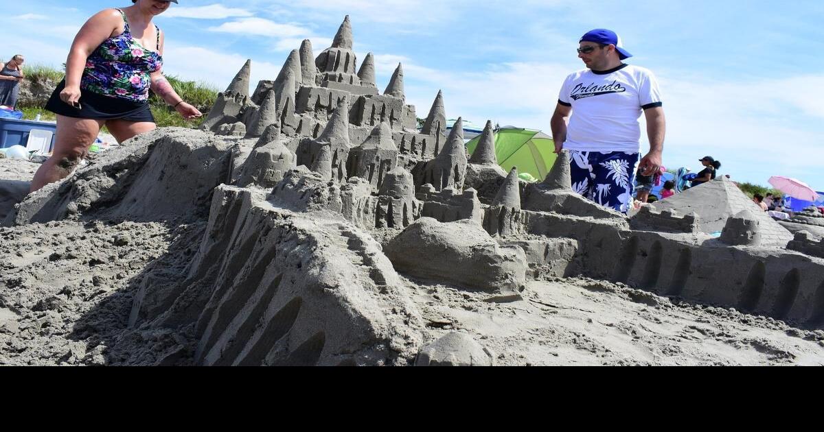 Beach architects from the Clam Harbour Sandcastle Competition spill ...