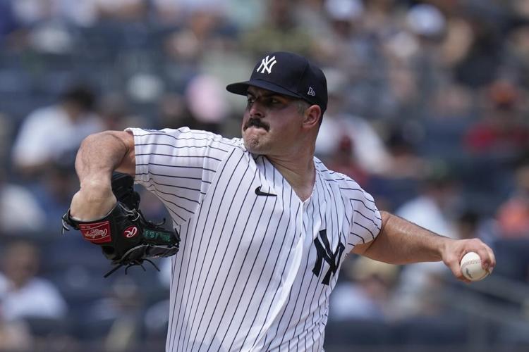 Yankees pitcher Carlos Rodón leaves his start against the Astros with ...