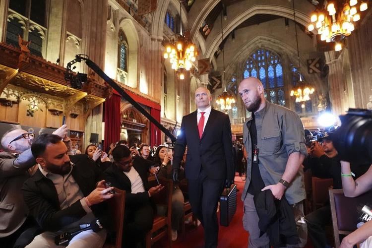 Usyk dresses as a hitman and gets Fury's signature in bizarre news ...