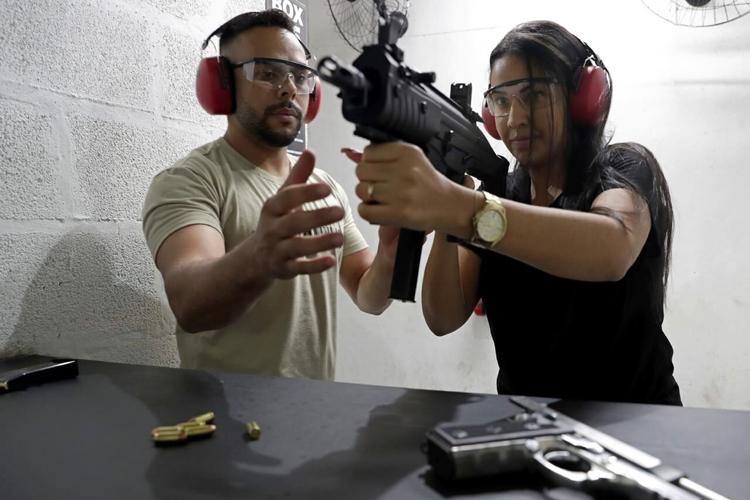 Brazil’s Bolsonaro moves to arm base, alarming gun experts