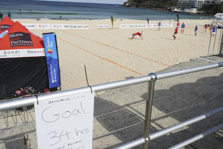 Australian friends claim world record for longest beach touch rugby game