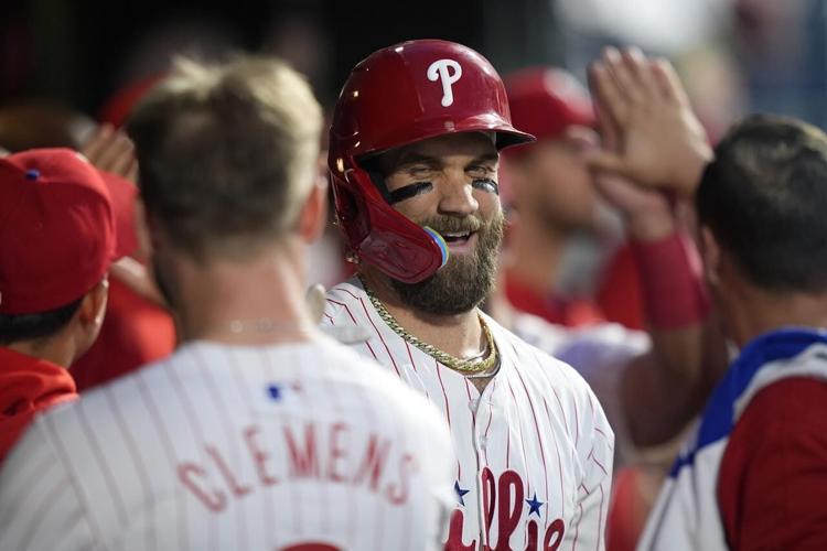 Harper hits grand slam, streaking Phillies rout Blue Jays 10-1