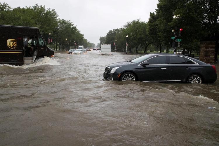 Rains strand Washington drivers, flood White House basement