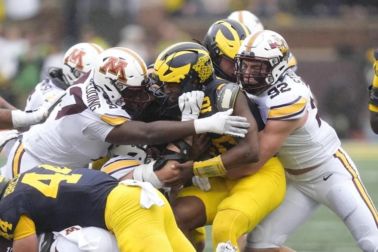 No. 12 Michigan holds off Minnesota in 4th quarter to win 27-24 and ...