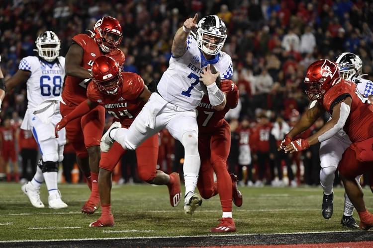 Levis runs for 4 TDs, Kentucky routs rival Louisville 52-21