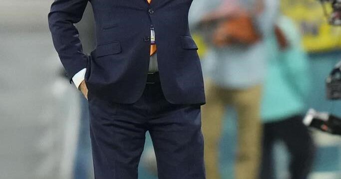 Netherlands coach Van Gaal hugs reporter at World Cup