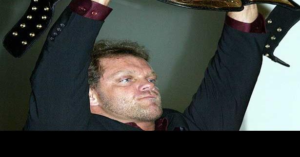 Wrestler's doctor surrenders to police