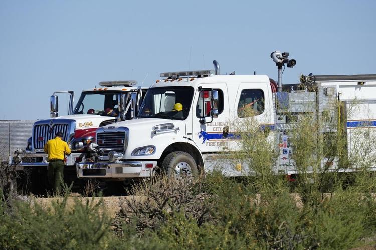 Over 1,000 people remain evacuated as crews dig containment line around ...