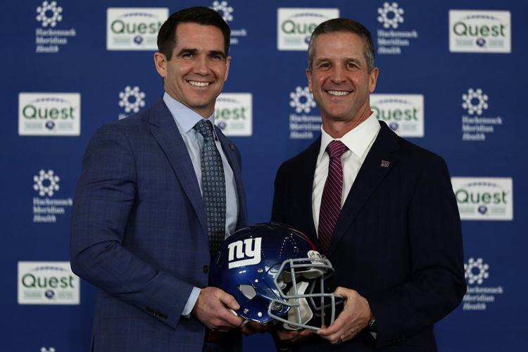 New coach John Harbaugh embraces the challenge of turning the Giants ...