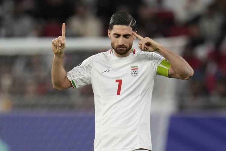Qatar advances to the Asian Cup final by beating Iran 3-2. Host nation ...