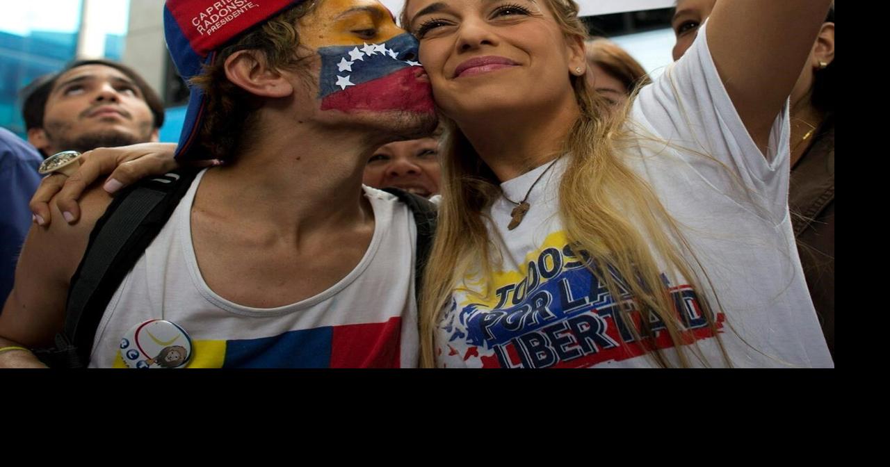 Venezuelan activist’s wife, daughter arrive in Spain