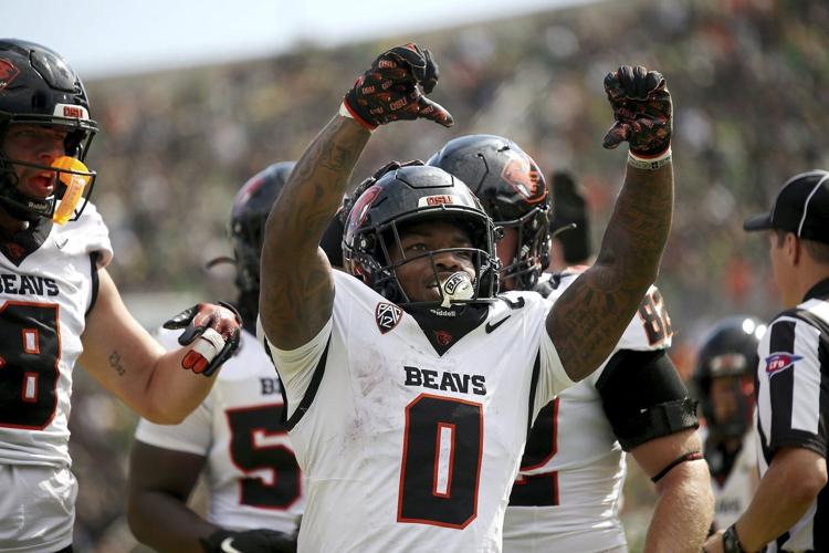 Moore throws career-best 4 TDs and No. 6 Oregon beats rival Oregon ...