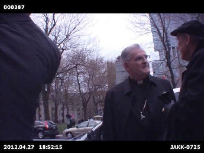 PHOTOS: Bishop served with lawsuit papers