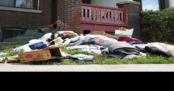 Neighbours raise stink over rotting trash piles