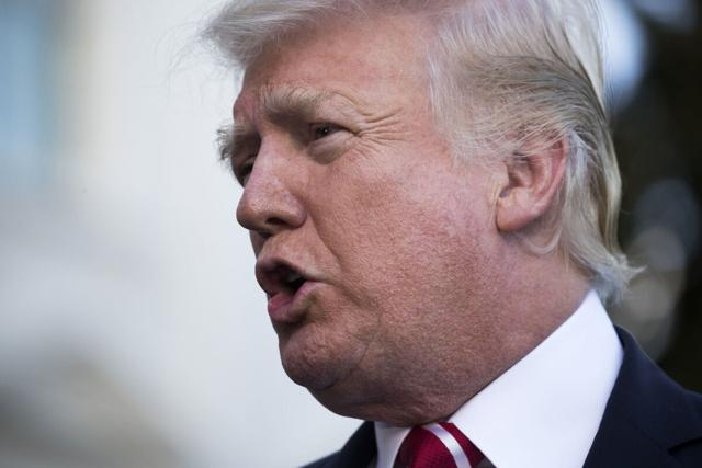 Trump defends tossing paper towels to Puerto Rico hurricane victims ...