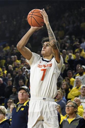 Tre White leads Illinois to a 93-73 rout of No. 15 Michigan