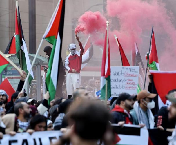 Thousands of protesters take over downtown Toronto streets