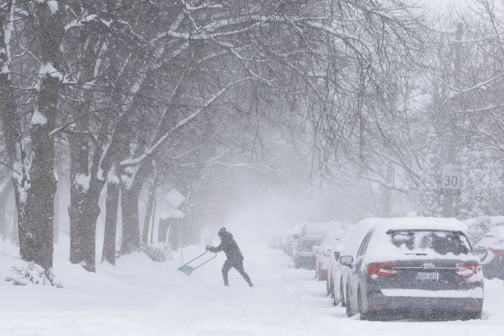 Toronto snowstorm wreaks havoc with roads, trains