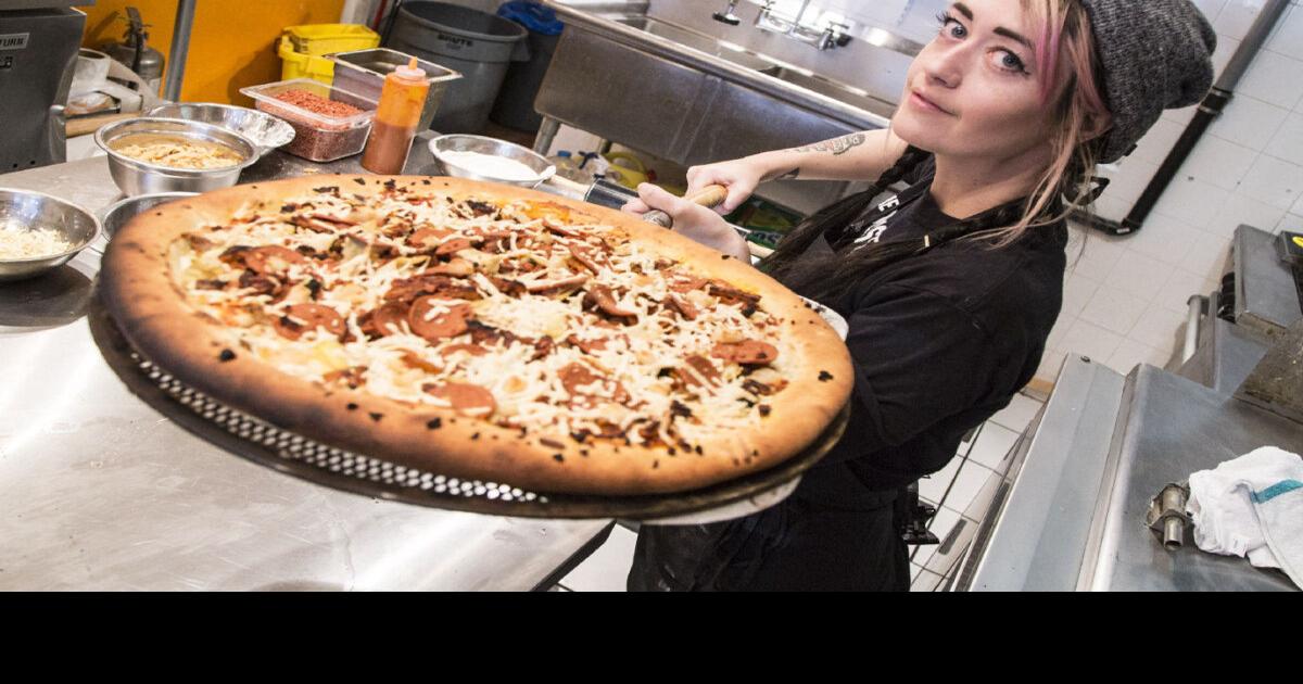 Vegan pizza maker layers Pig Destroyer Destroyer pizza with 5 kinds of fake meat