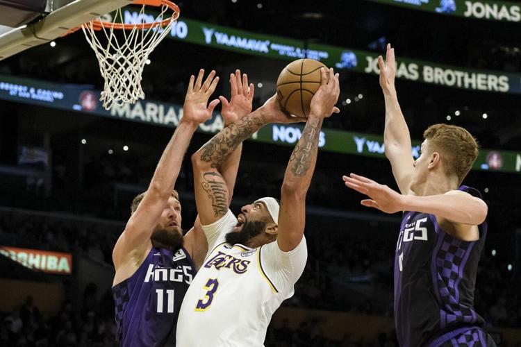 LeBron James records triple-double, Davis scores 31 in Lakers' 131-127 ...