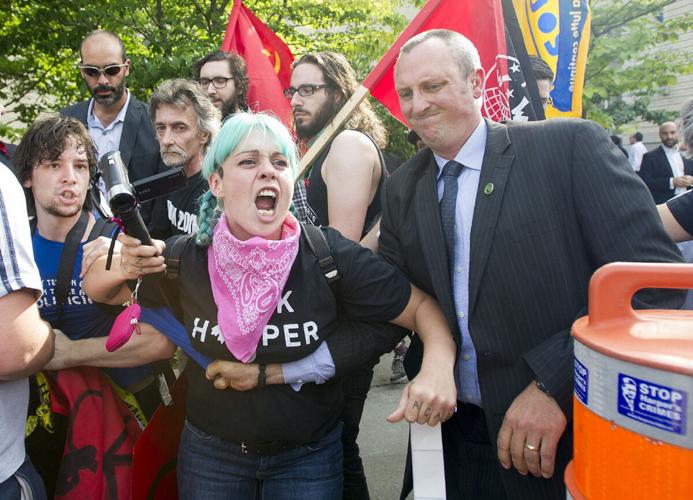 Harper opens election campaign in Montreal, met by protesters