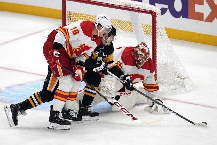 Malkin, Penguins surge past Flames with 5 goals in third for 5-2 win