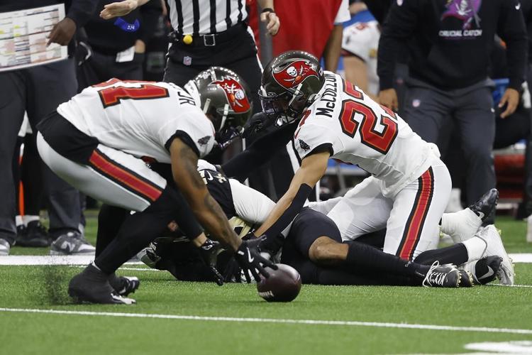 Saints receiver Chris Olave sidelined against Tampa Bay by an unflagged ...