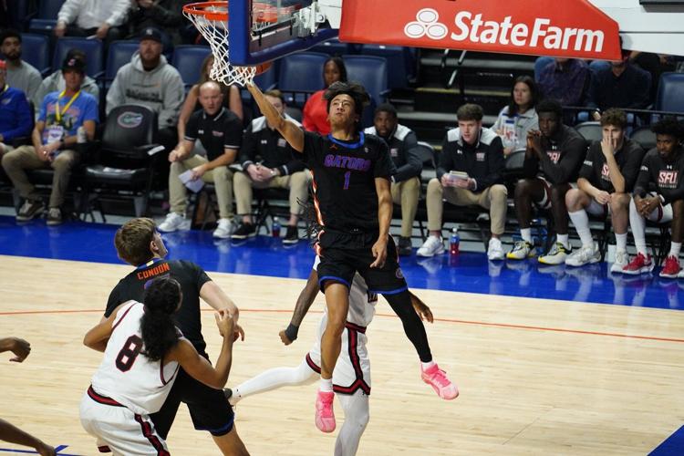 World's tallest teen dunks for first college field goal as No. 23 ...