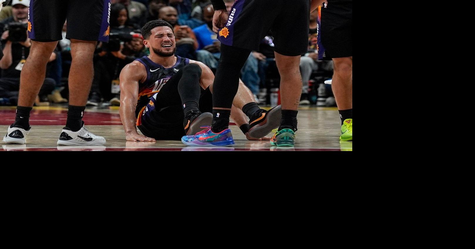 Suns All-Star guard Devin Booker to miss at least a week with sprained ankle