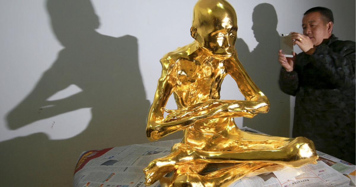 Chinese monk mummified, covered in gold leaf in rare honour