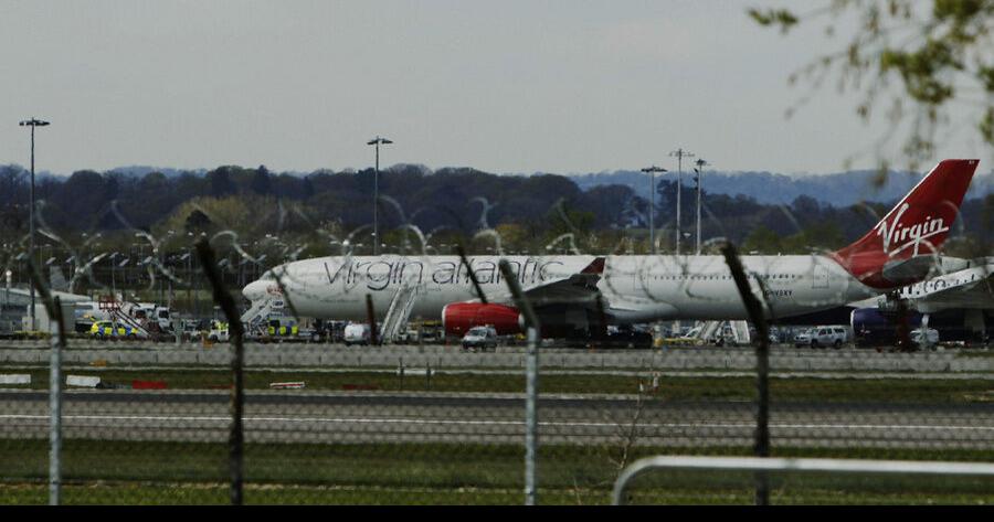 Virgin Atlantic passengers flee plane using slides after emergency ...