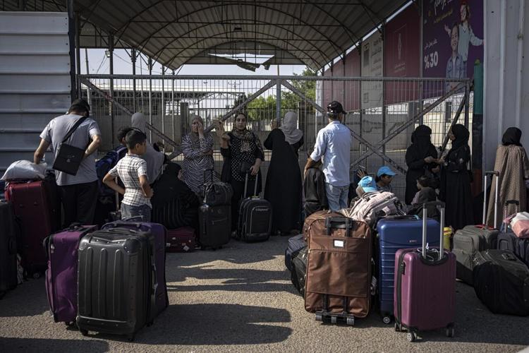 Confusion, frustration and hope at Gaza's border with Egypt as first ...