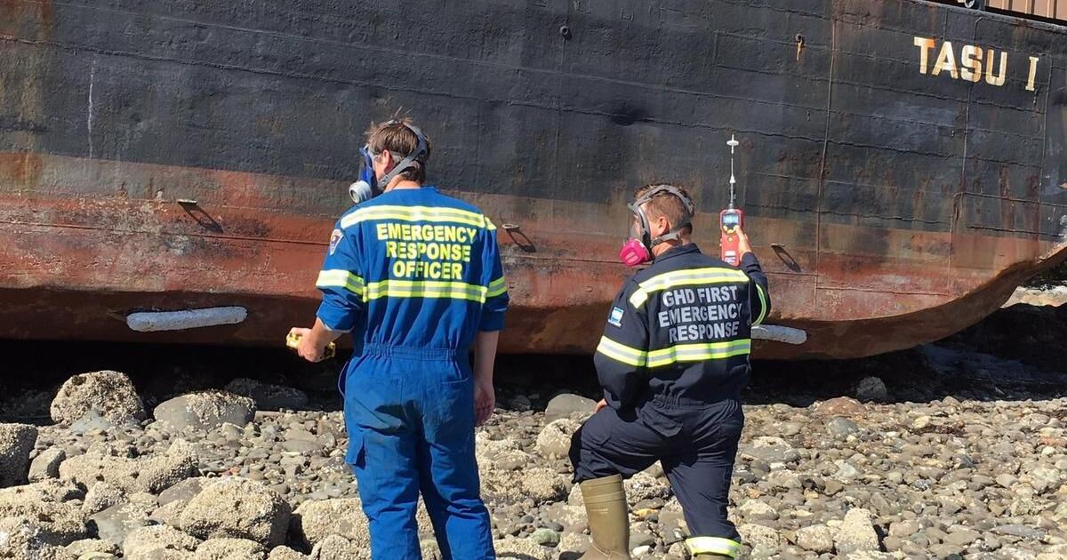 Work begins to remove cargo from grounded, potentially explosive barge ...