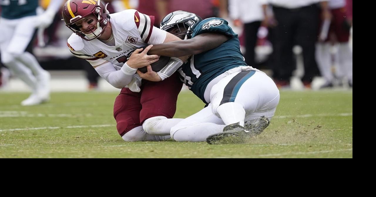 Commanders’ Wentz fumbles, struggles in 1st game vs. Eagles