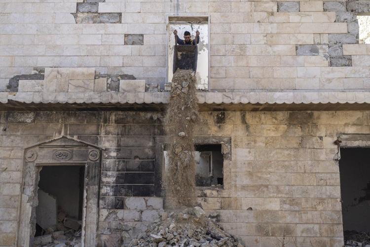 AP PHOTOS: In northern Syria, displaced owners return to houses with no ...
