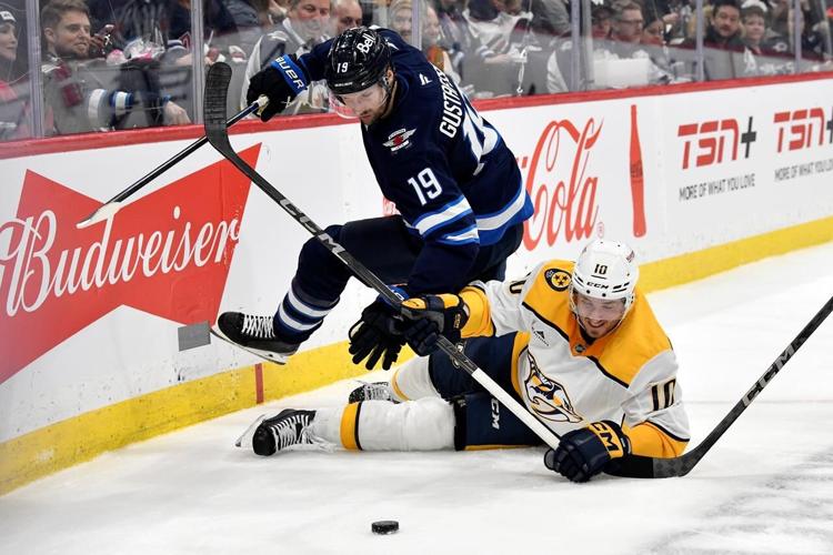 Hellebuyck nets 300th win as Jets soar past Predators 5-2