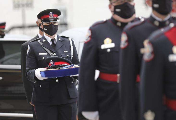Partner of killed Toronto cop says she identified herself