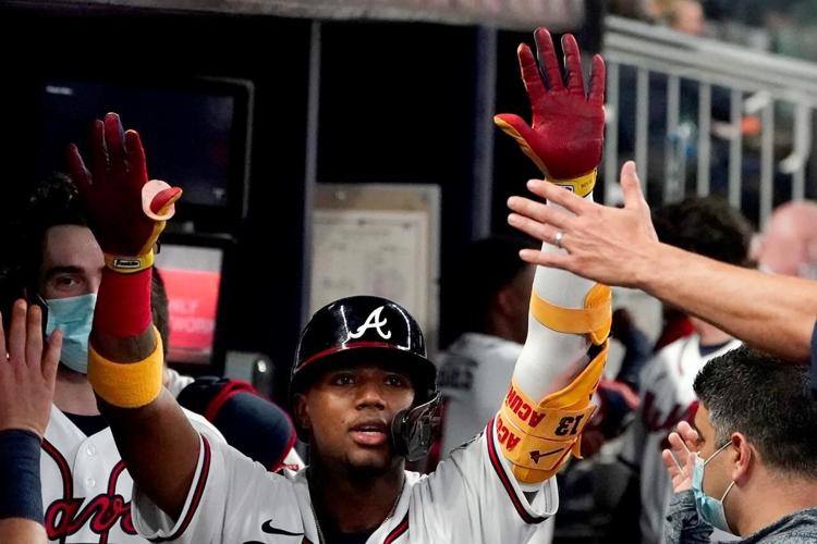 Acuña hits long HR as Anderson, Braves shut down Cubs 5-0