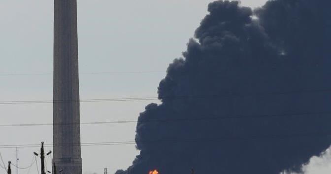 The Latest: Fire at Texas storage facility briefly flares up