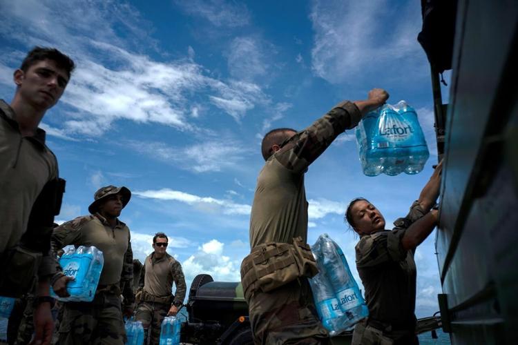 Survivors on Bahamas island mark time as officials lay plans