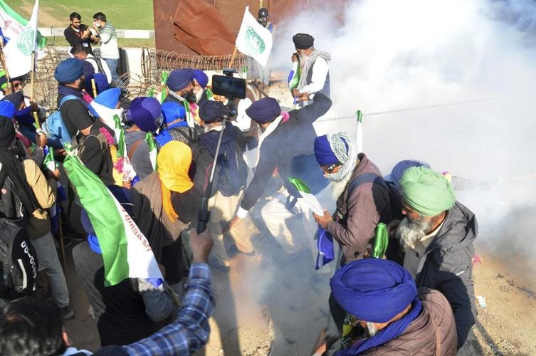 Police in India clash with farmers during protest march over minimum ...