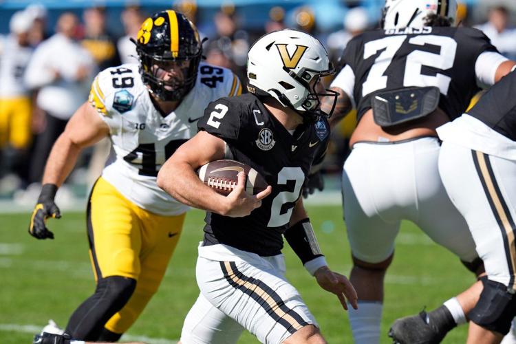 Iowa holds off Vanderbilt's comeback bid for 34-27 victory in the ...