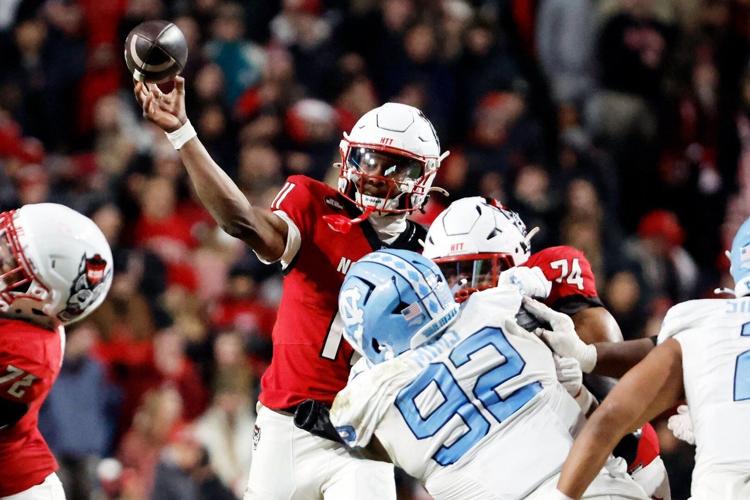 Wilson runs for 4 TDs as NC State beats UNC 42-19, winning rivalry game ...