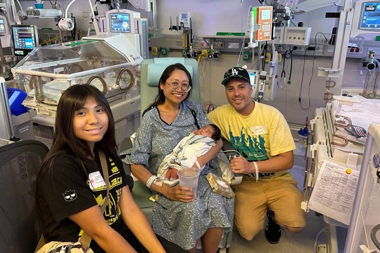 'The best gift ever': Baby is born after the rarest of pregnancies ...