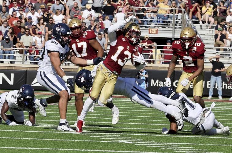 Kye Robichaux runs for 2 TDs; BC outlasts UConn 21-14 for 4th straight win